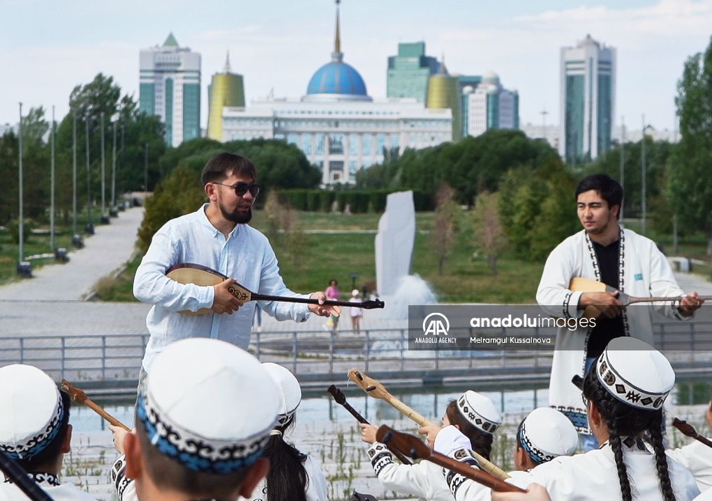 Kazakh singer and music teacher Ibragim Eskendir gives dombra lessons ...