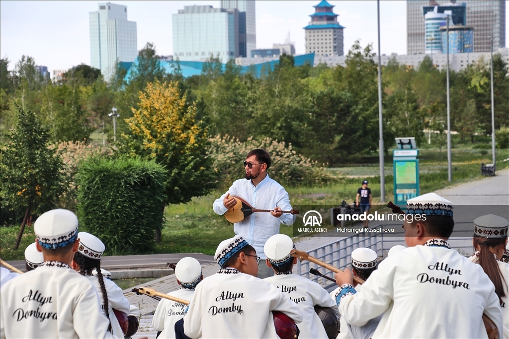 Kazakh singer and music teacher Ibragim Eskendir gives dombra lessons ...