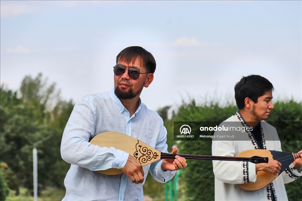 Kazakh singer and music teacher Ibragim Eskendir gives dombra lessons ...