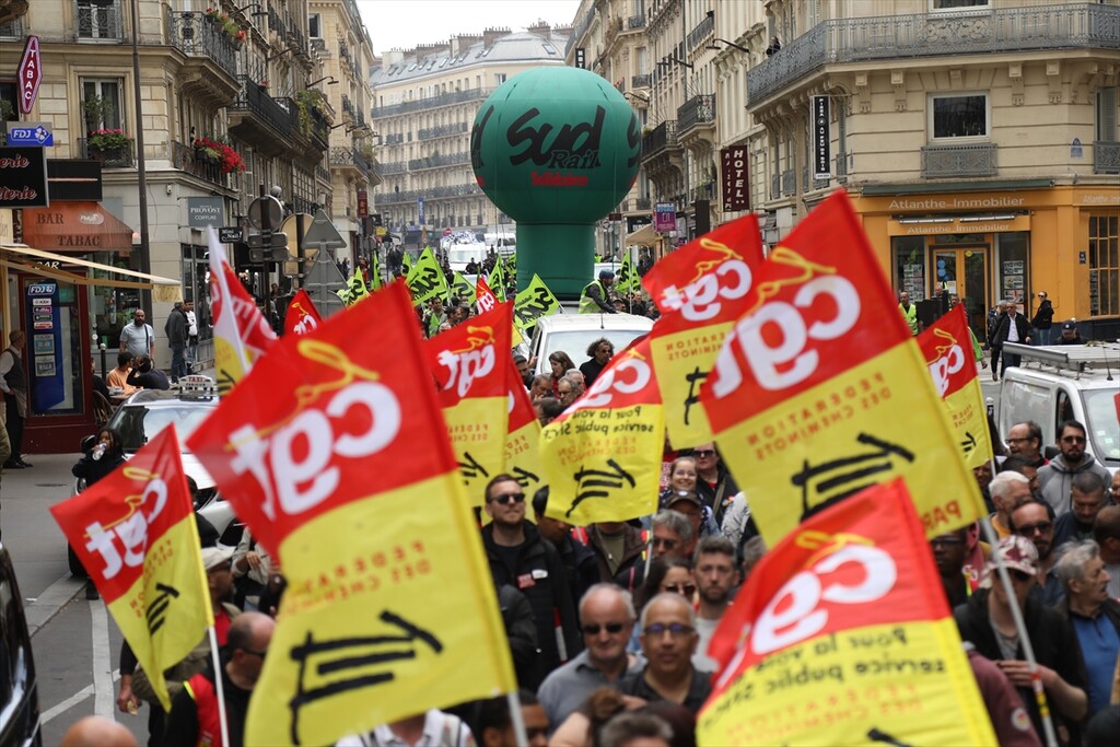 SNCF workers take part in a demonstration during a national strike in Paris