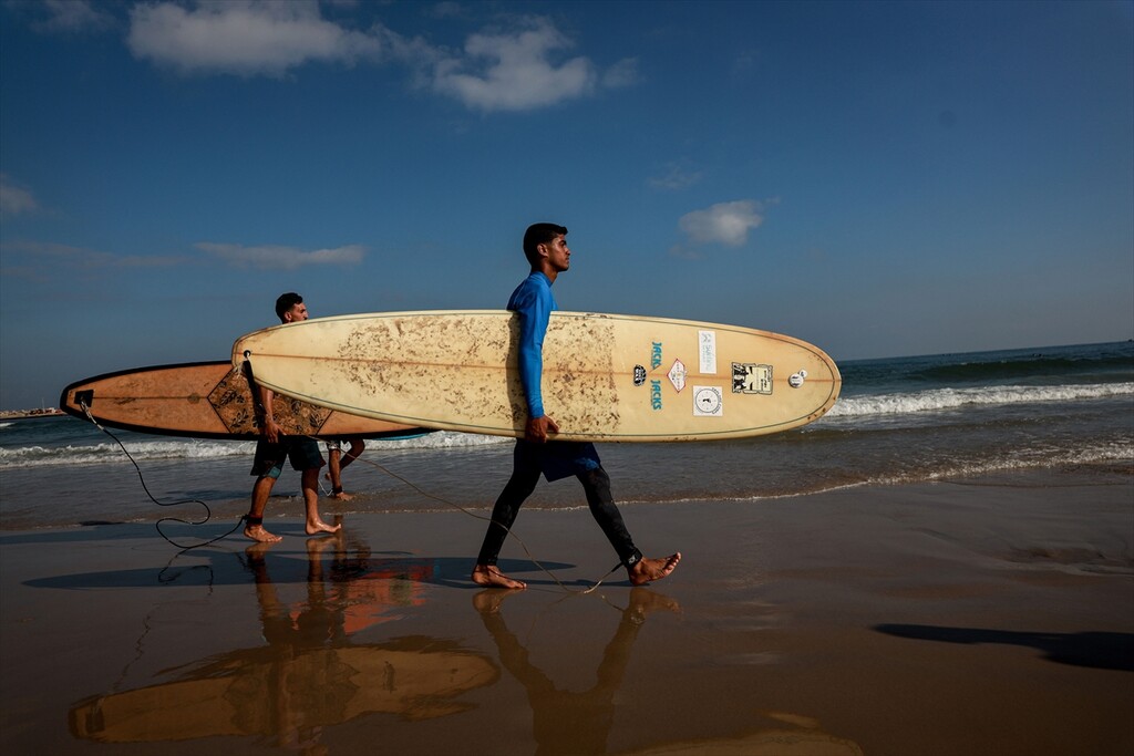 Young Gazans turn to surfing amid hardship and summer heat